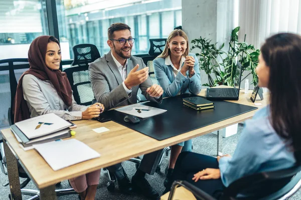 Human resource team talking to a candidate during a job interview in ...