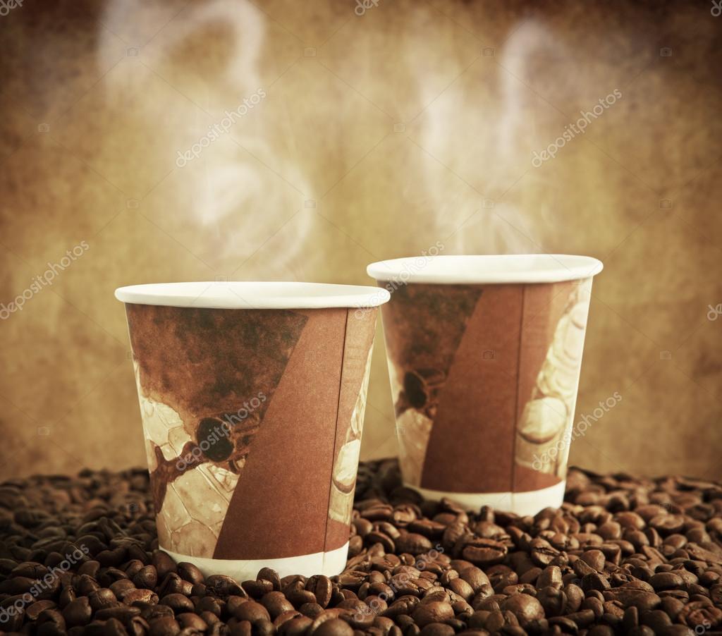 Paper cups with coffee beans — Stock Photo © dedivan1923 #19546109