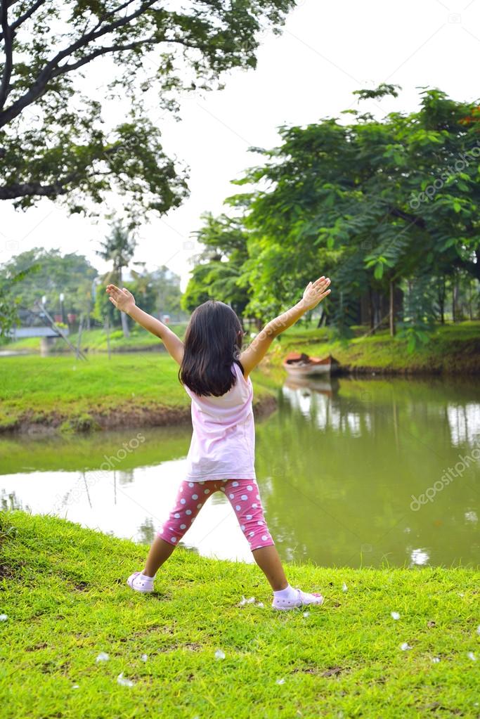 Little Girl From Behind On The Park — Stock Photo © leolintang #40513911