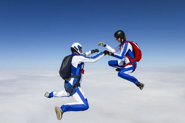 Skydiving holding hands Stock Photos, Royalty Free Skydiving holding ...