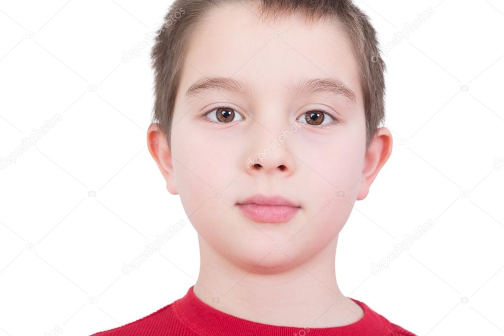Handsome young boy with a serious expression — Stock Photo © oocoskun ...