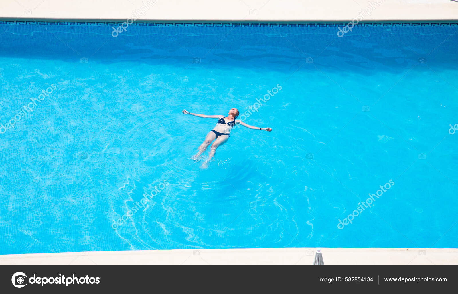 Top View Woman Floating Swimming Pool — Stock Photo © melis82 #582854134
