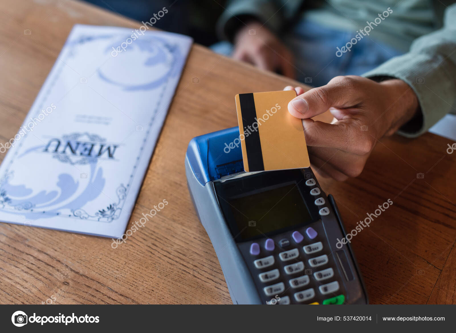 Partial View Man Credit Card Payment Terminal Menu Brochure Table ...