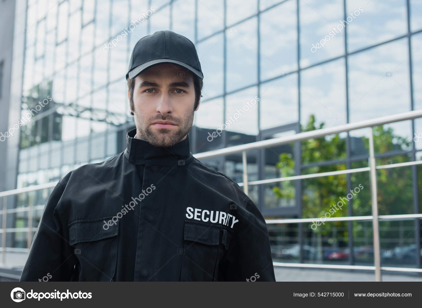 Young Security Man Black Uniform Looking Camera Building Glass Facade ...