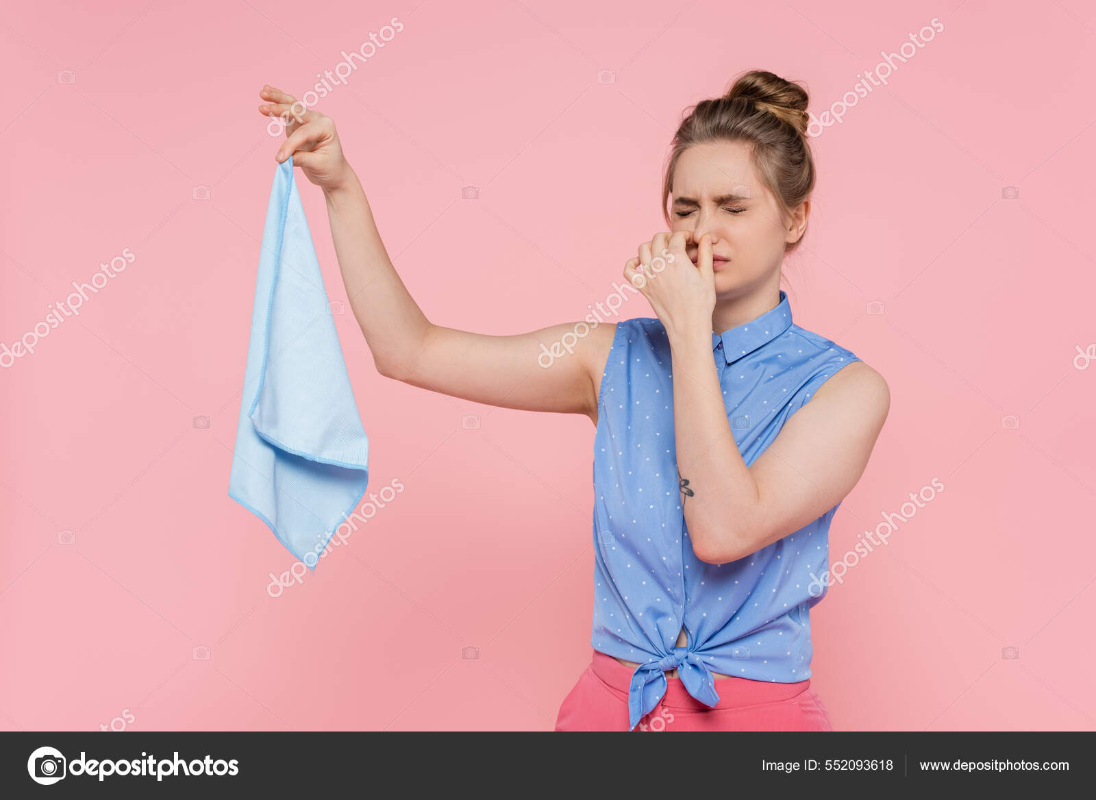 Disgusted Young Woman Plugging Nose Holding Blue Rag Isolated Pink ...