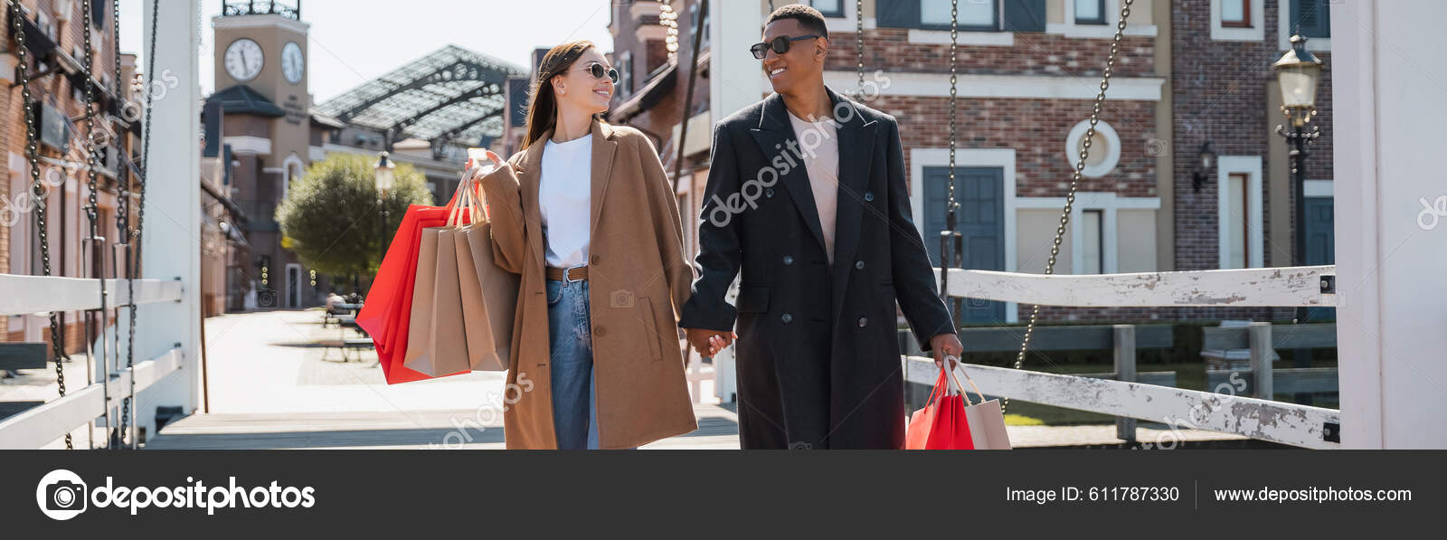 Joyful Multicultural Couple Sunglasses Carrying Shopping Bags Holding ...