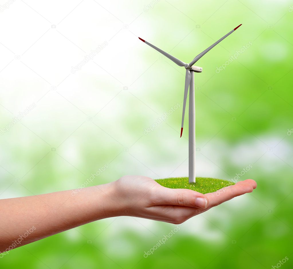 Wind turbine in hand on green background — Stock Photo © vencav #27419927