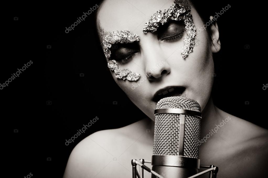 Gothic singer standing with microphone Stock Photo by ©Baton72 13544713