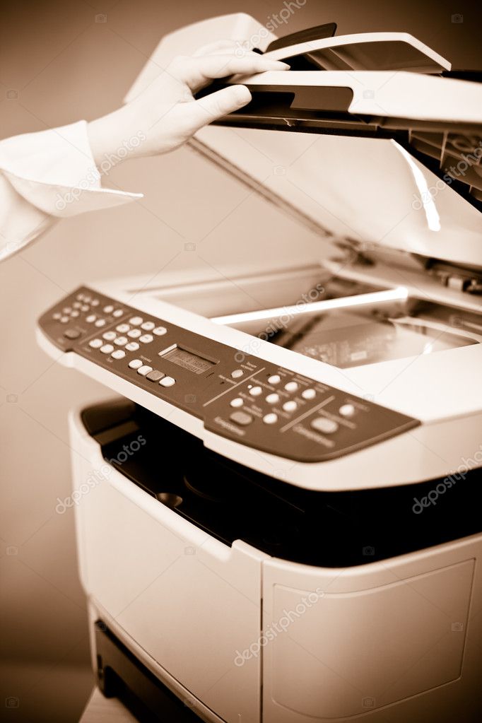 Woman's hand with copier Stock Photo by ©Baton72 27886619