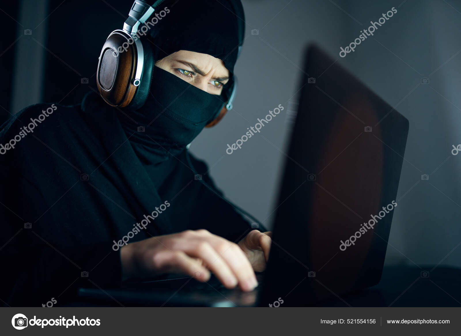 Woman in mask in front of laptop headphone hacking Stock Photo by ...