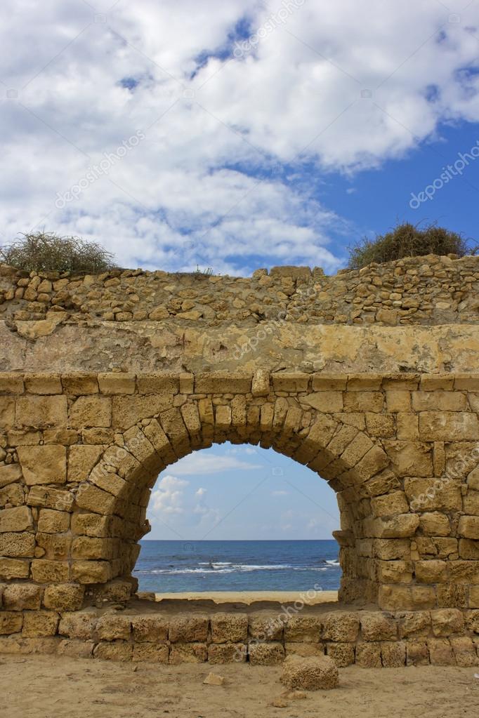 View of the Mediterranean Sea through a stone arch — Stock Photo ...
