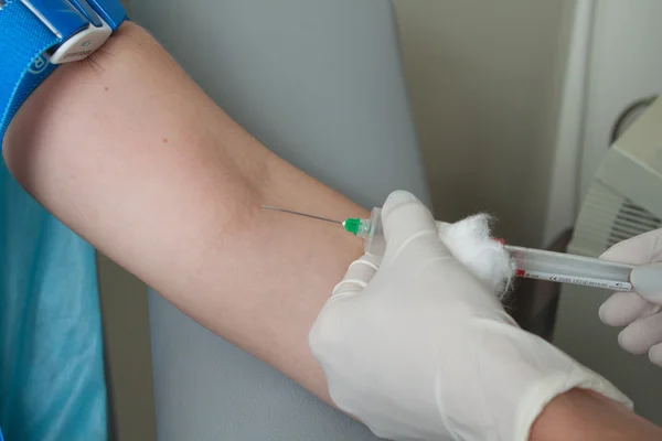 Drawing blood procedure Stock Photo by ©alexhg1 11186053