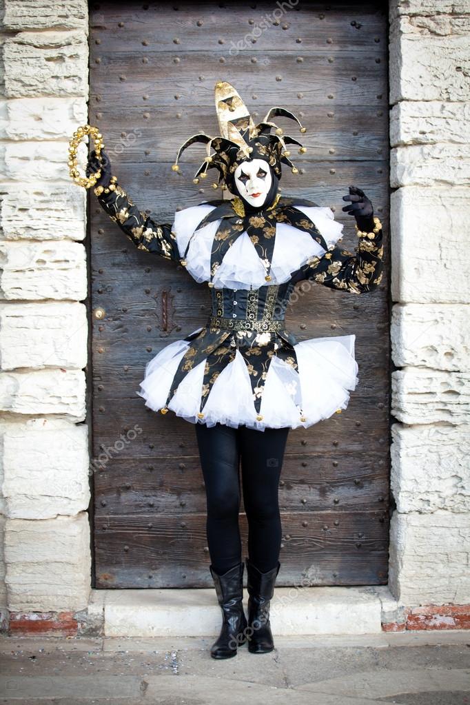 Dancing Jester in Venice Italy with a gold tamberine — Stock Photo ...