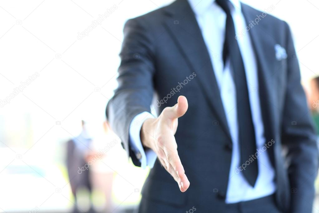 A business man with an open hand ready to seal a deal Stock Photo by ...