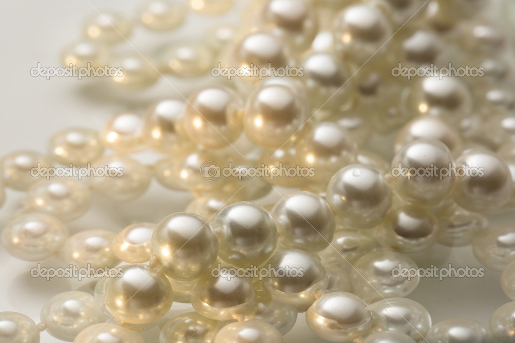 Shining string of white pearl in water — Stock Photo © Garsya #12589337