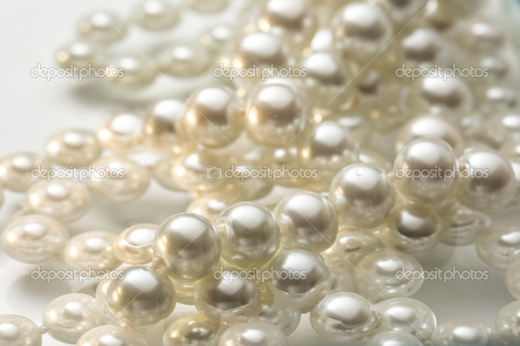 Shining string of white pearl in water Stock Photo by ©Garsya 12590012