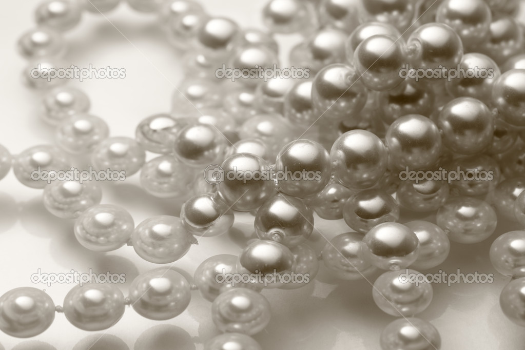 Shining string of white pearl in water — Stock Photo © Garsya #23280174