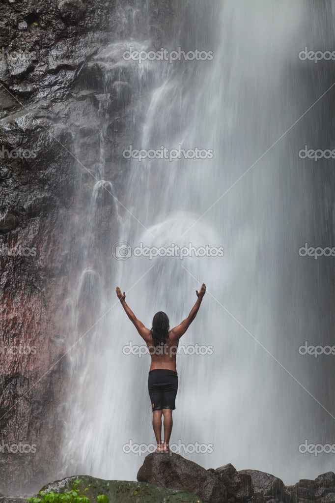 Man at waterfall Stock Photo by ©paulprescott 30679819