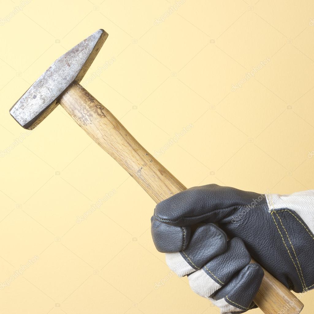 The hand holding the hammer Stock Photo by ©natalt 21636069