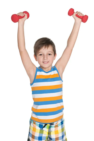 Boy exercise with dumbbells — Stock Photo © Kokhanchikov #1595079