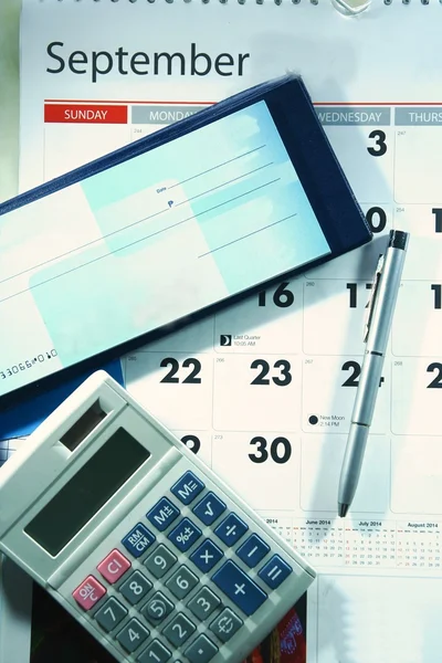 Calendar, checkbook, calculator, money and a ballpen — Stock Photo ...