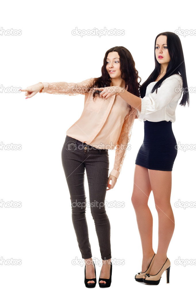 Two standing young women point at something Stock Photo by ©fee76 42466237