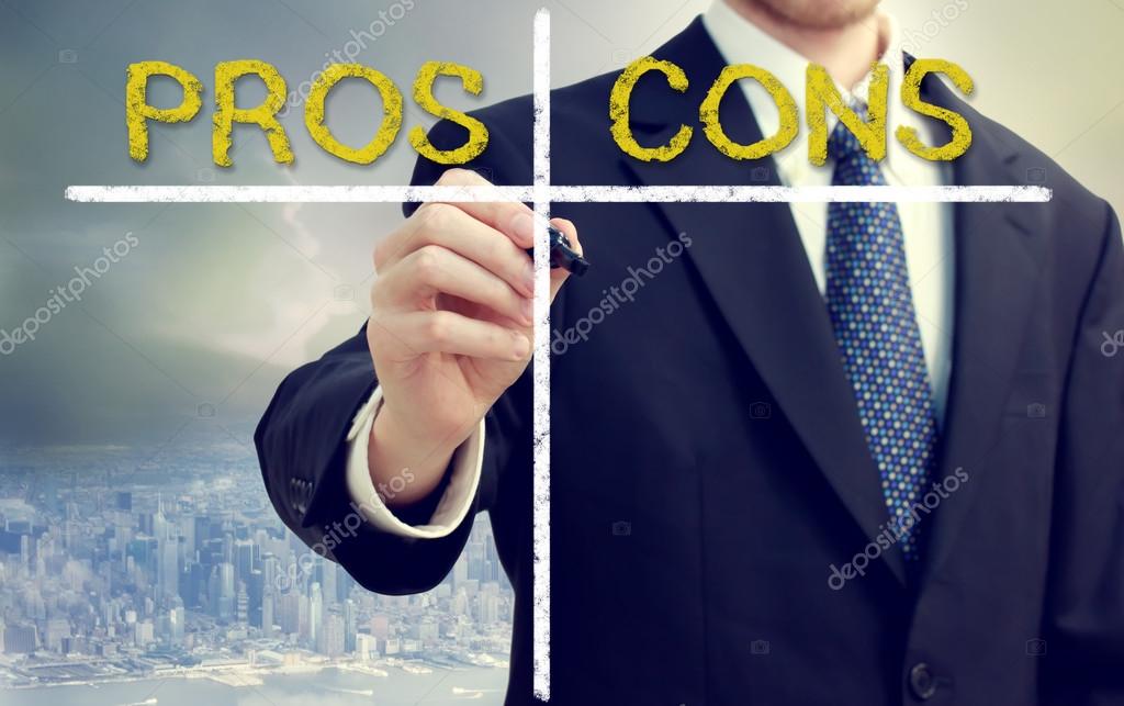 Business man writing pros and cons — Stock Photo © Melpomene #22772194