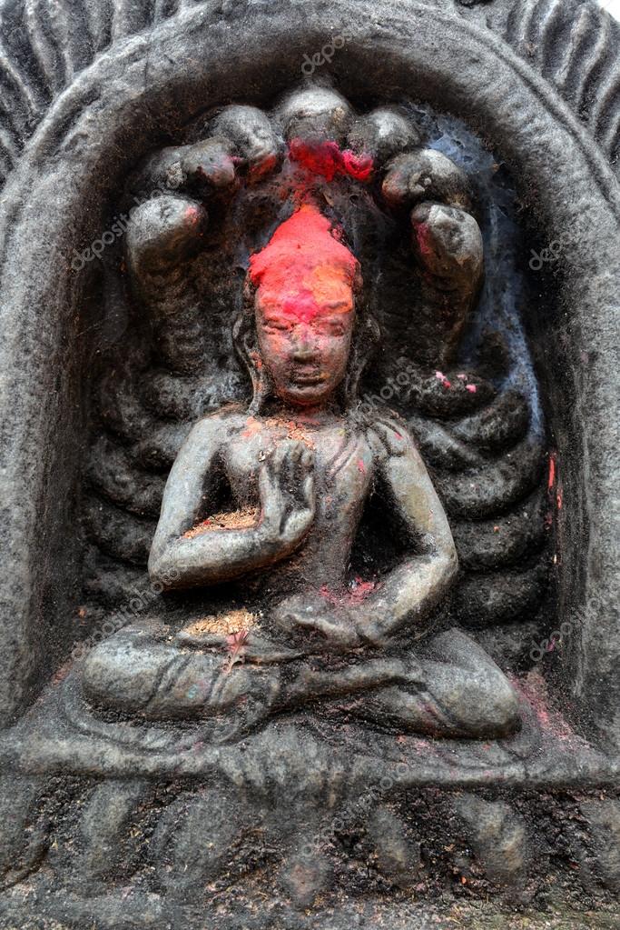 Ancient bas relief statuette of sitting Buddha in Swayambhunath ...