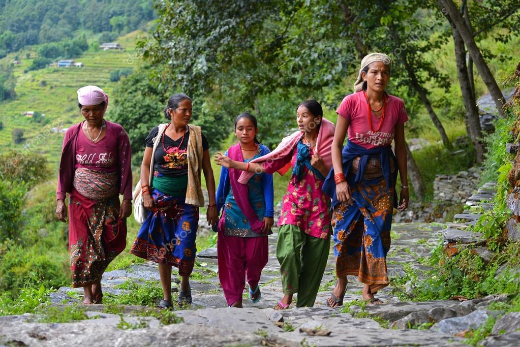 A Woman Wearing Traditional Dress In Front Of The Himalaya Mountains ...