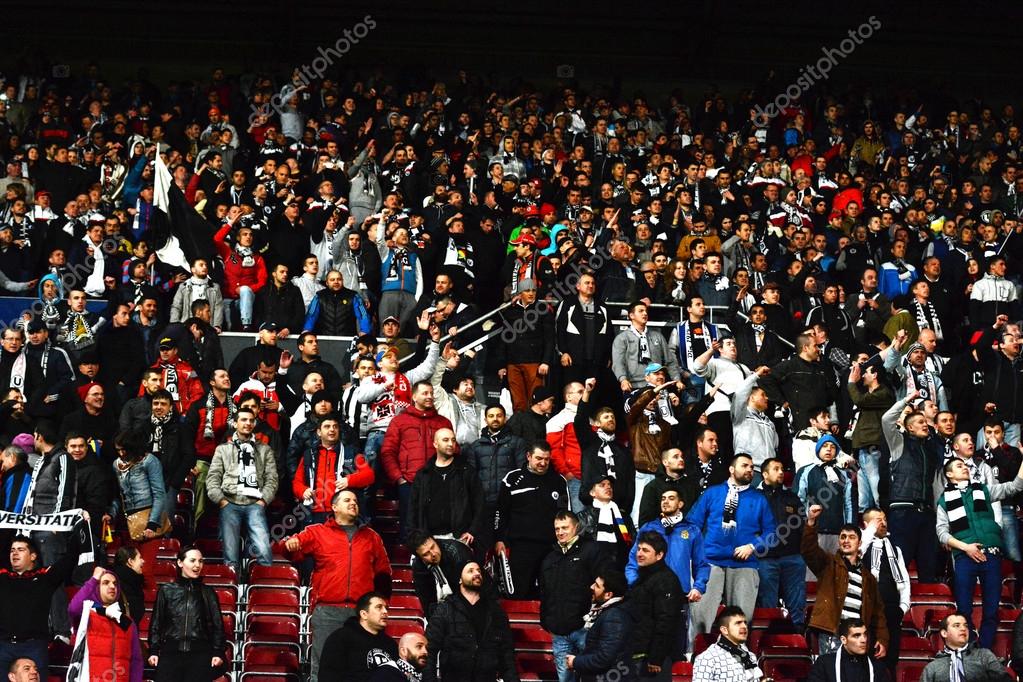 Soccer fans in a stadium — Stock Editorial Photo © salajean #43661683