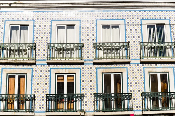 Facade of a building covered with traditional Portuguese tiles. Typical ...