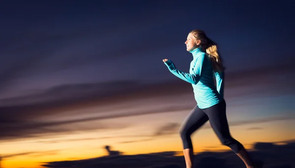 Female runner silhouette, running into sunset — Stock Photo ...