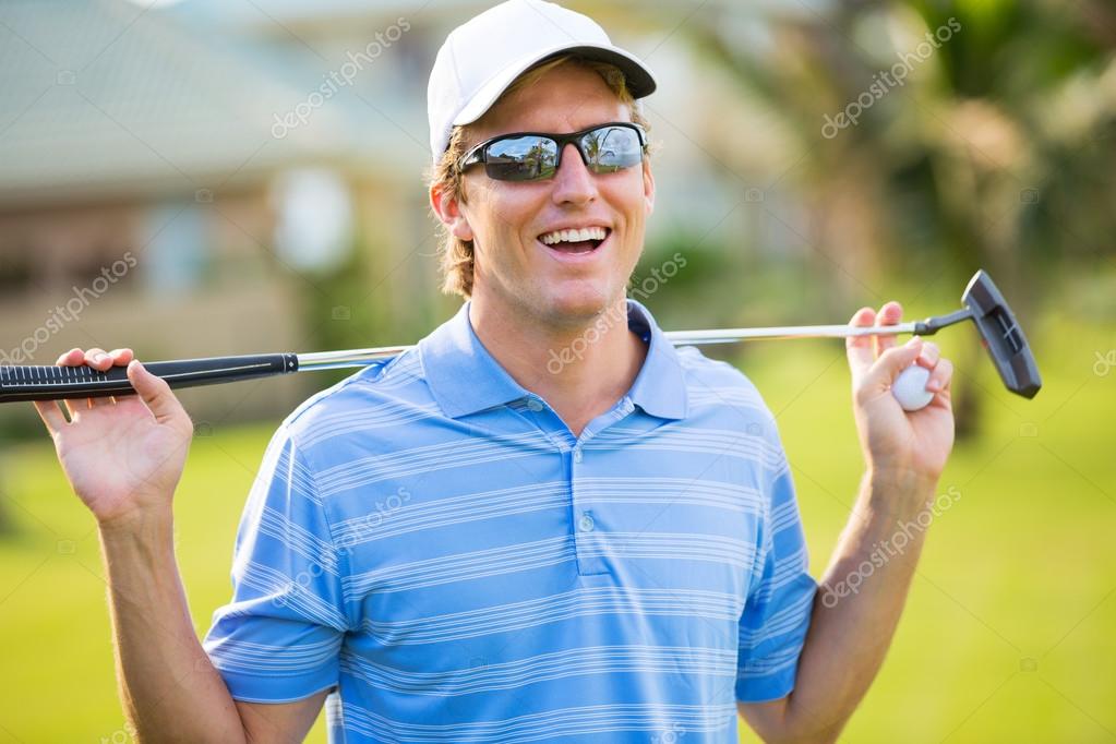 Athletic young man playing golf — Stock Photo © EpicStockMedia #34810039