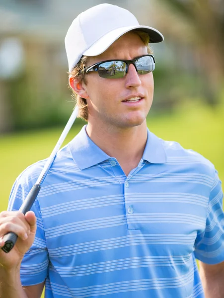 Athletic young man playing golf - Stock Image - Everypixel