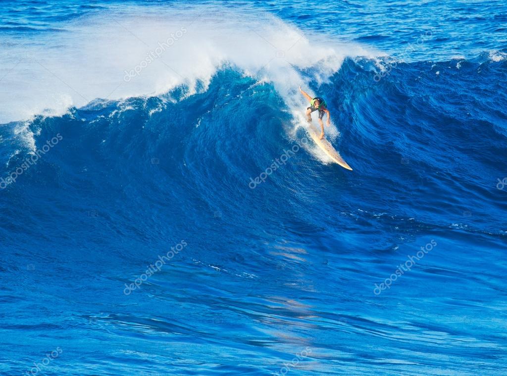 Surfer riding giant wave Stock Photo by ©EpicStockMedia 40056839