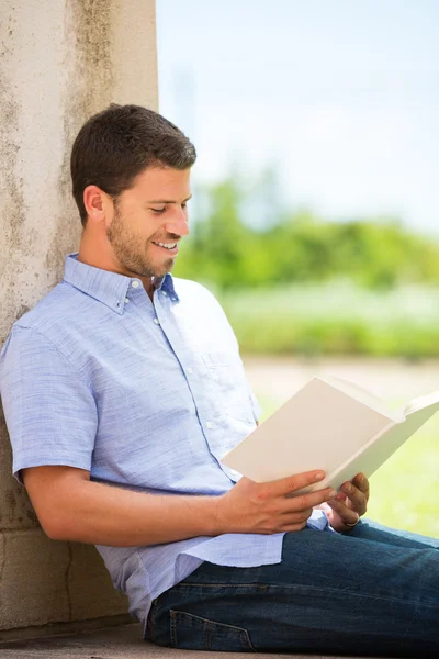 Man reading book outside - Stock Image - Everypixel