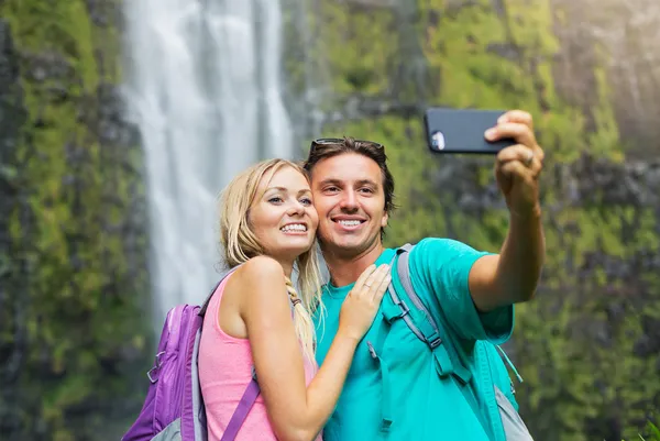 Couple taking pictures together on hike - Stock Image - Everypixel