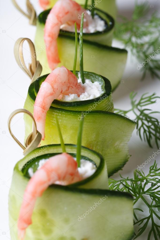 Appetizer buffet: cucumber rolls with shrimp vertical macro Stock Photo ...