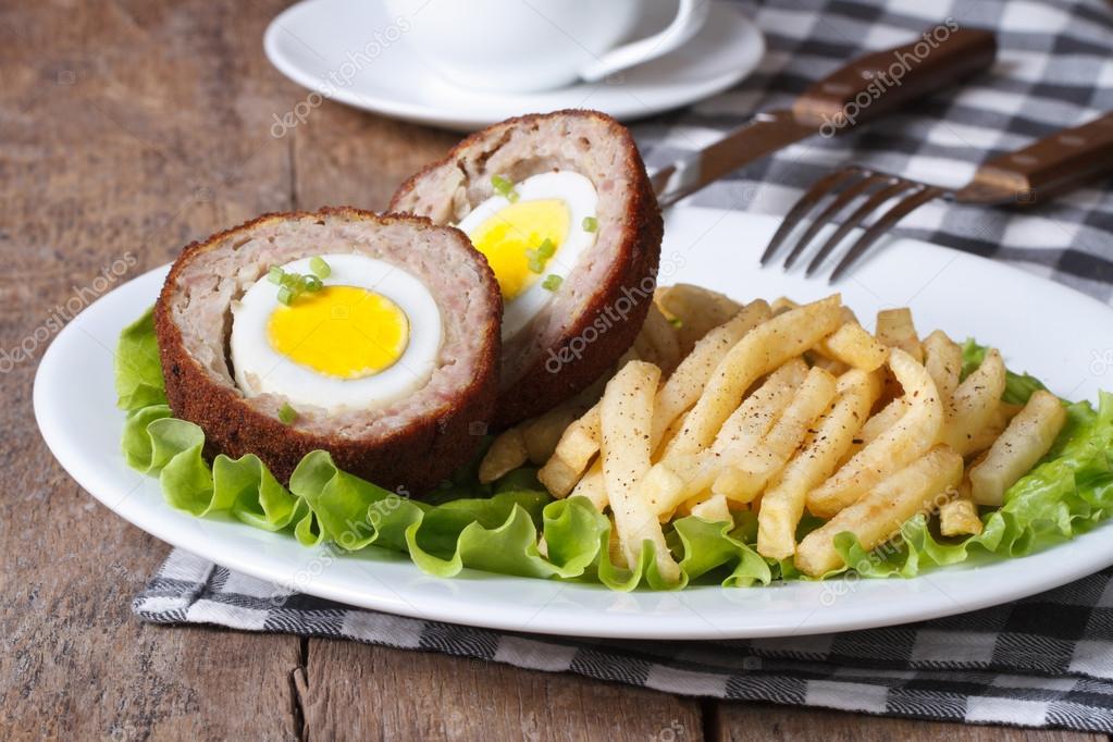 Meat stuffed with egg and French fries close-up Stock Photo by ...