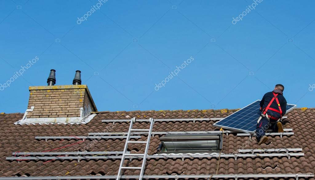 Man putting the solar panel on the roof — Stock Photo © compuinfoto ... Man putting the solar panel on the roof — Stock Photo © compuinfoto ...
