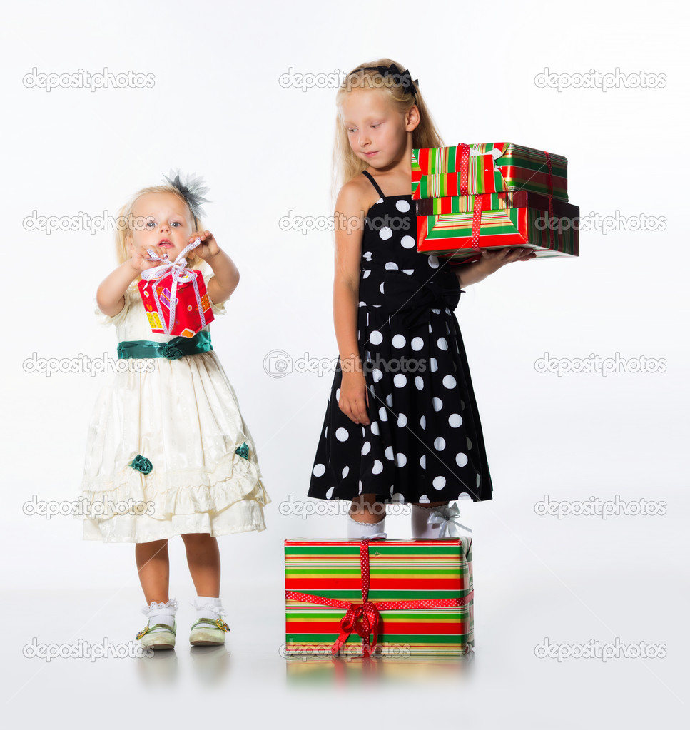 Two little girls with presents Stock Photo by ©kirill_grekov 30659493