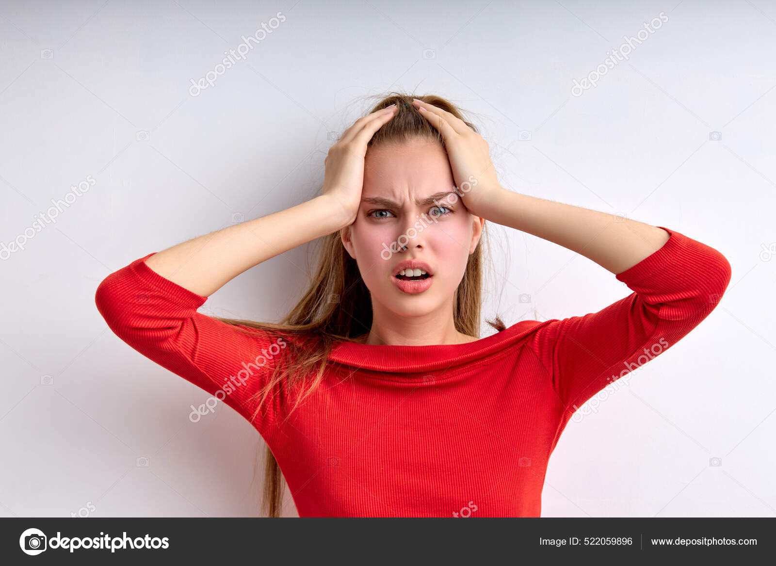 Puzzled Caucasian female opens mouth widely from surprisement, feels ...