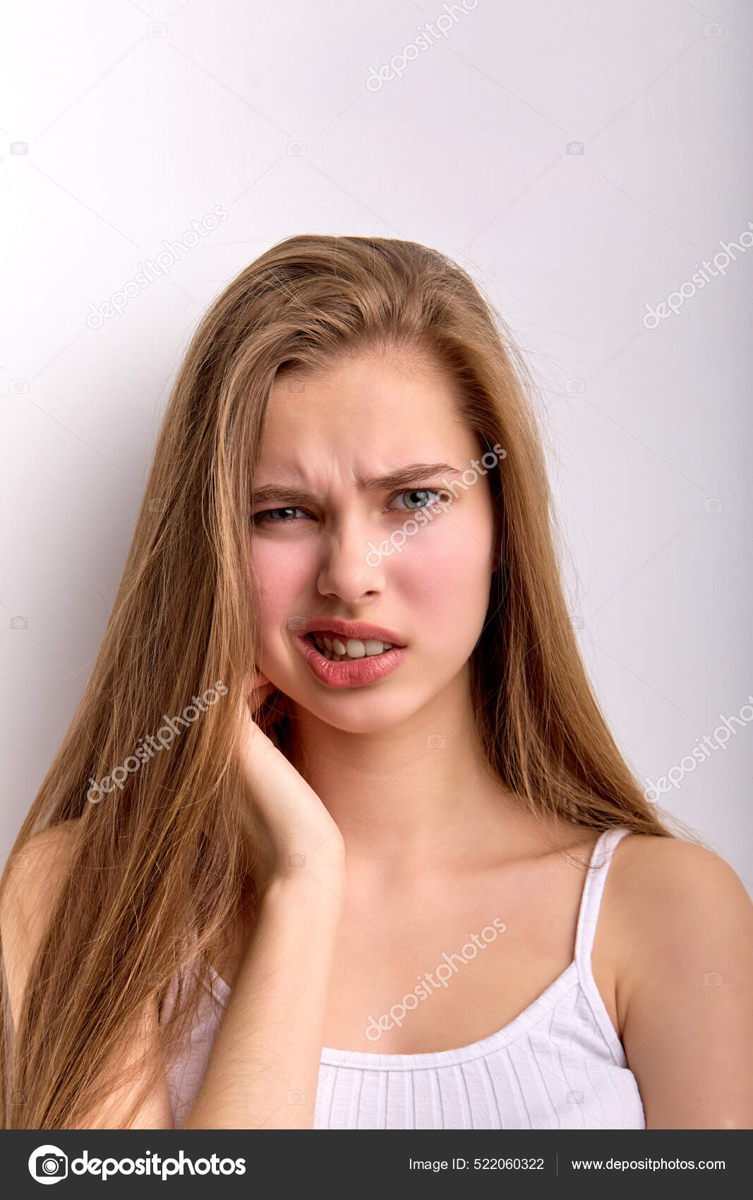 Puzzled perplexed female is dissatisfied with something, looking ...