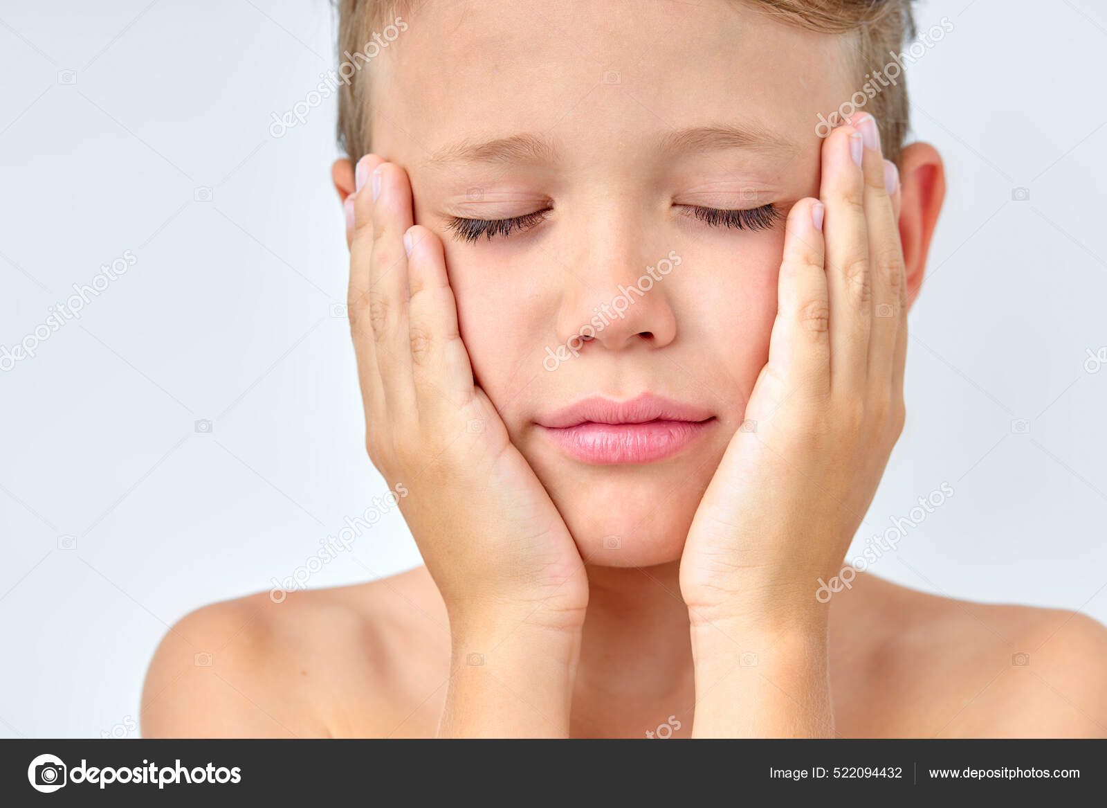 Calm sleepy boy touching cheeks, keeping eyes closed, isolated on white ...