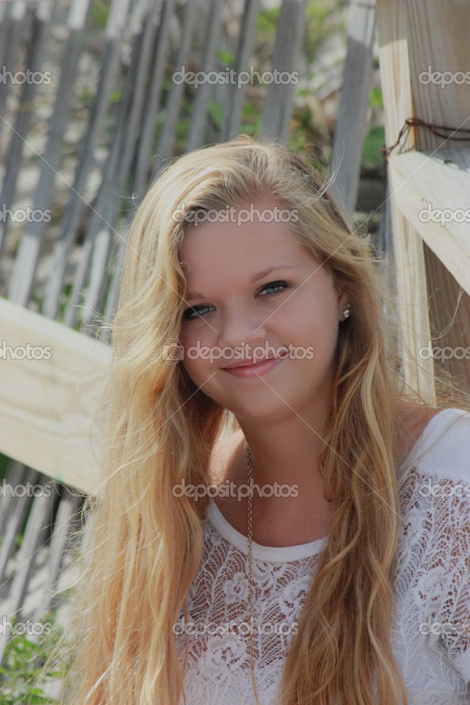 Beautiful Young lady at the beach — Stock Photo © debsmemories #12807718