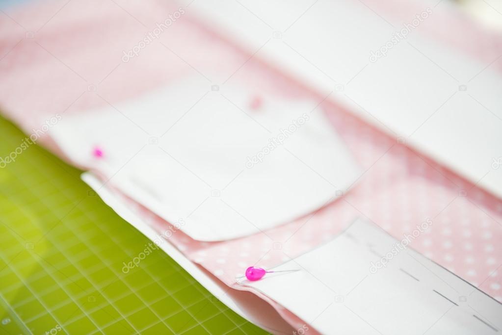 Seamstress pattern on fabric — Stock Photo © CITAlliance #47476359