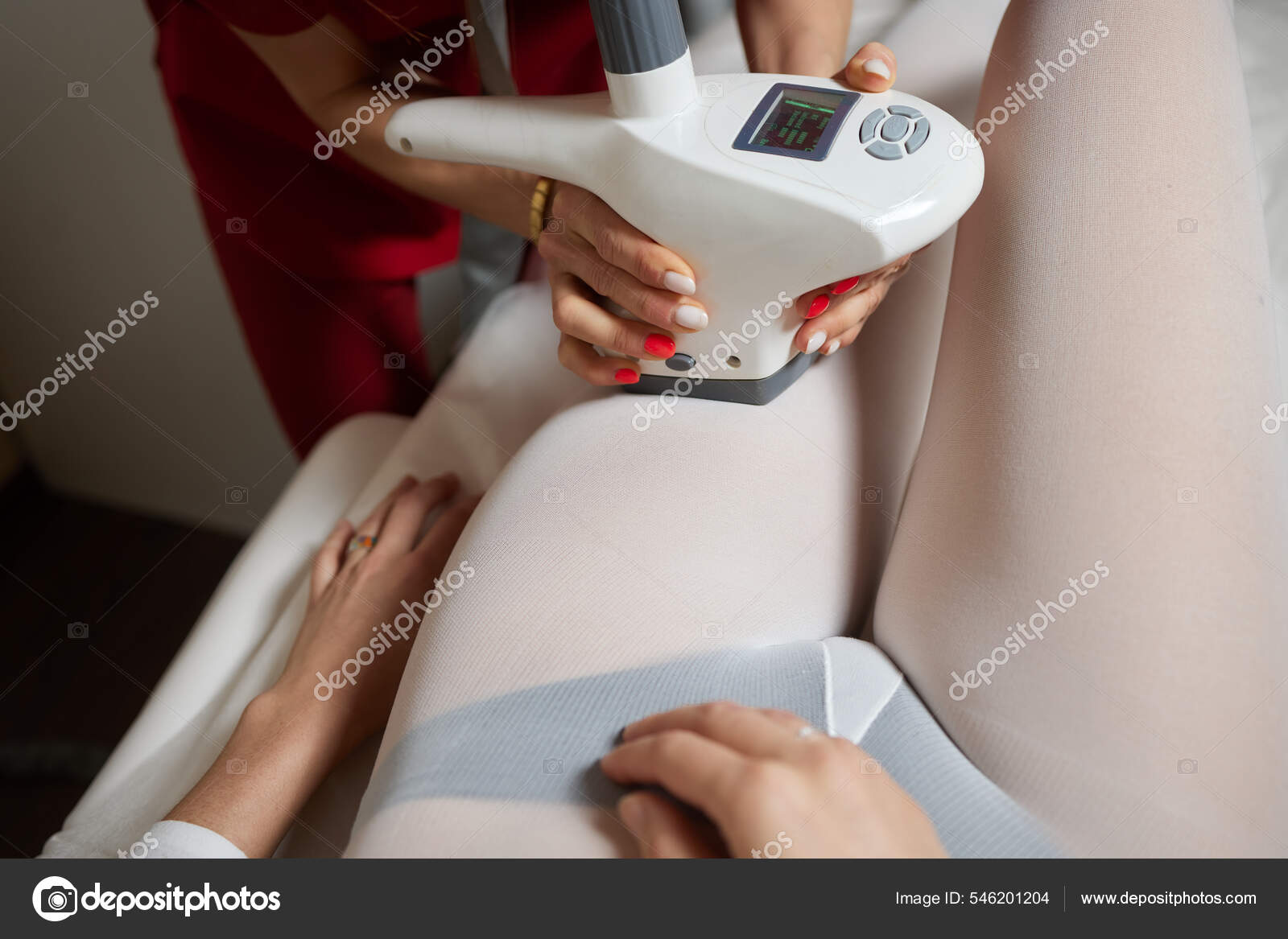 Female client in white suit lying an her tomach, getting LPG massage in a spa. Stock Photo by ...