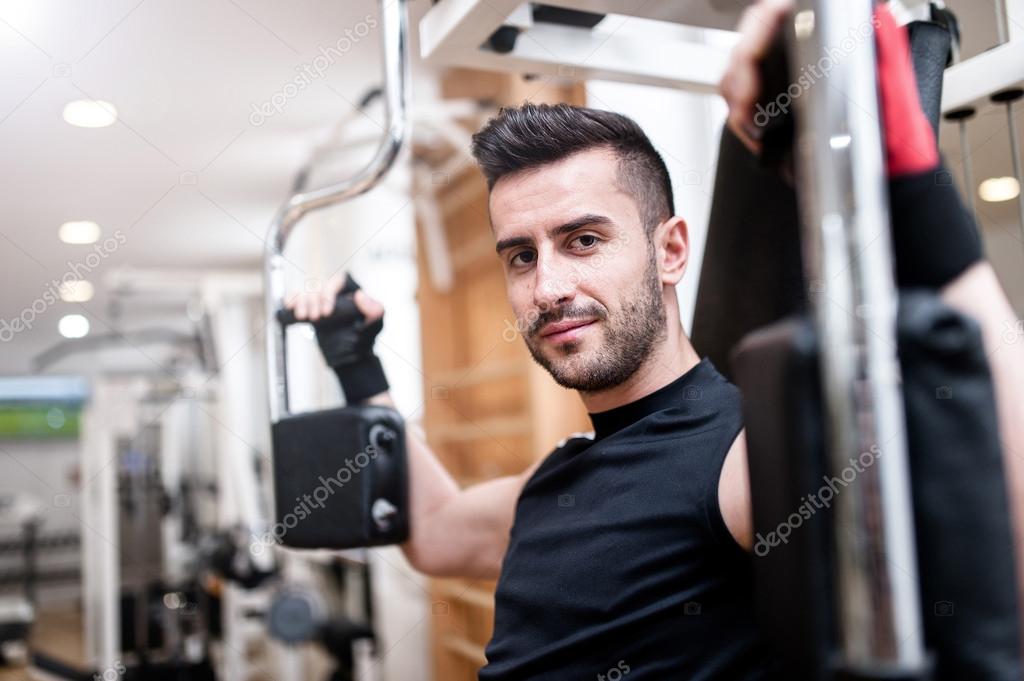 Handsome man working out at gym, daily chest exercise routine. Fitness ...