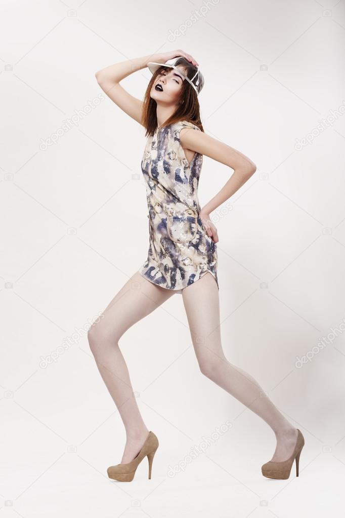 Fashion Style. Dynamic Modish Woman in Modern Dress - Artistic Pose ...