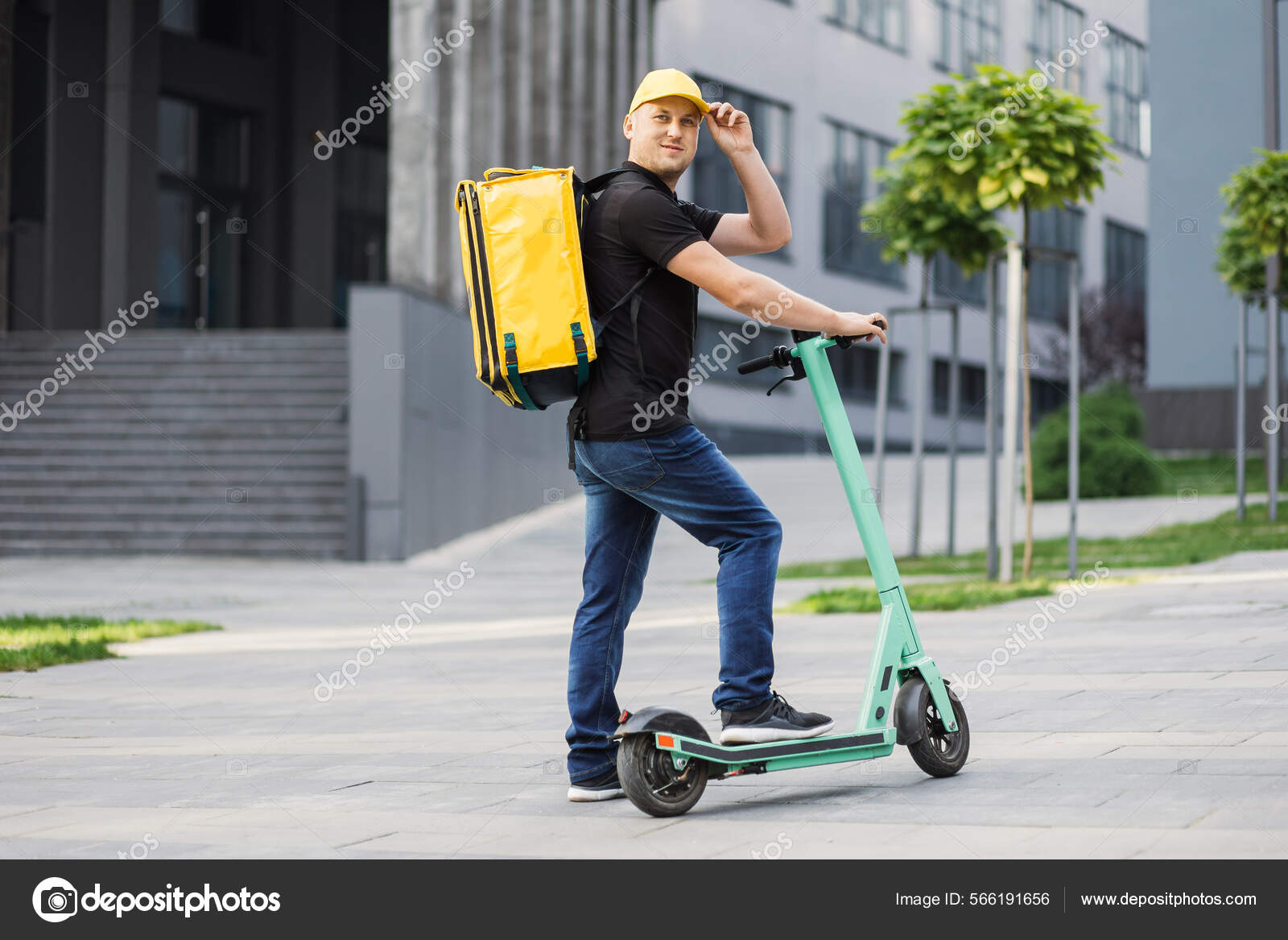 Delivery man deliver fresh hot food, rides fast on an electric scooter ...